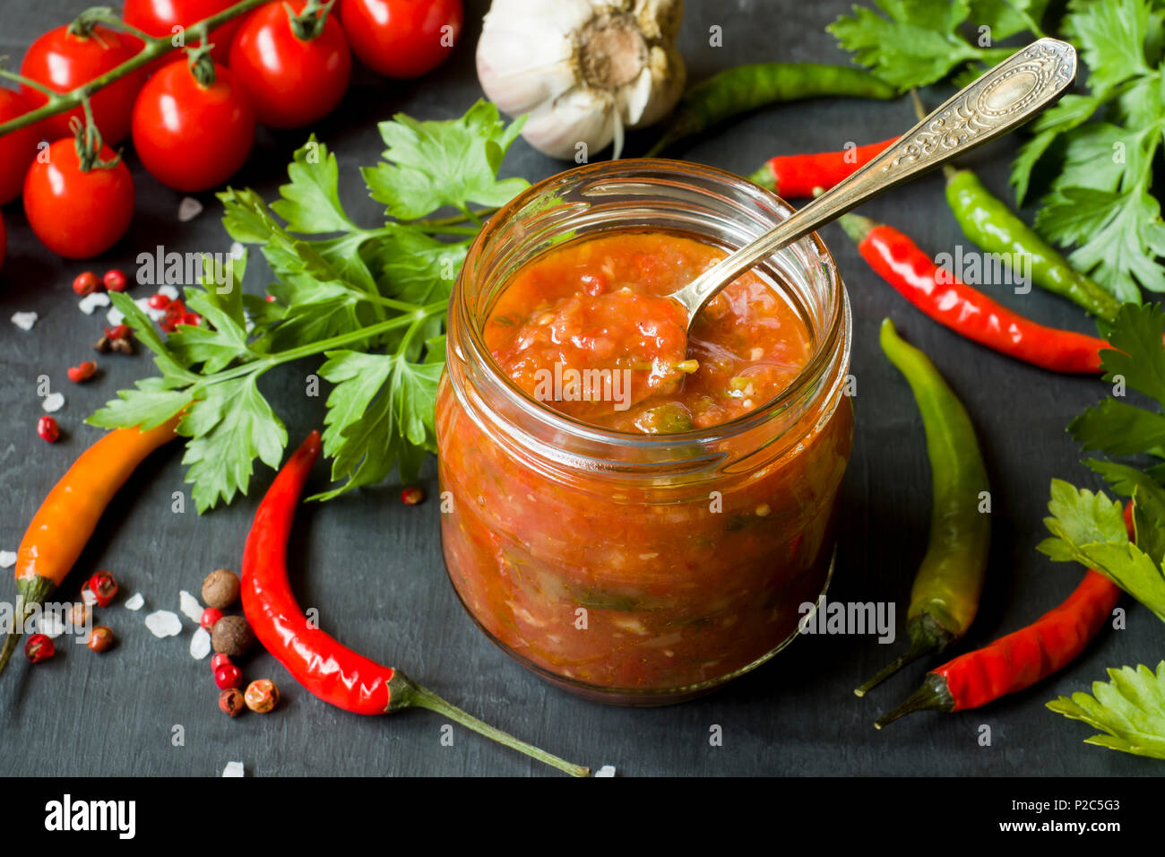 Sauce ketchup, Lecho in glass jar. Chili tomato cherry garlic and other ...