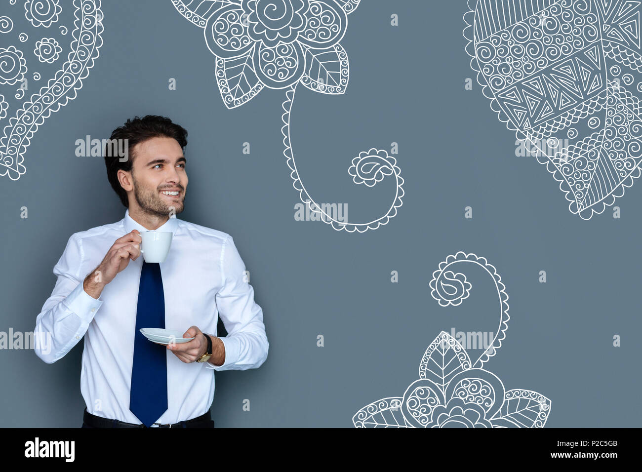 Happy lawyer smiling and drinking his morning coffee Stock Photo - Alamy