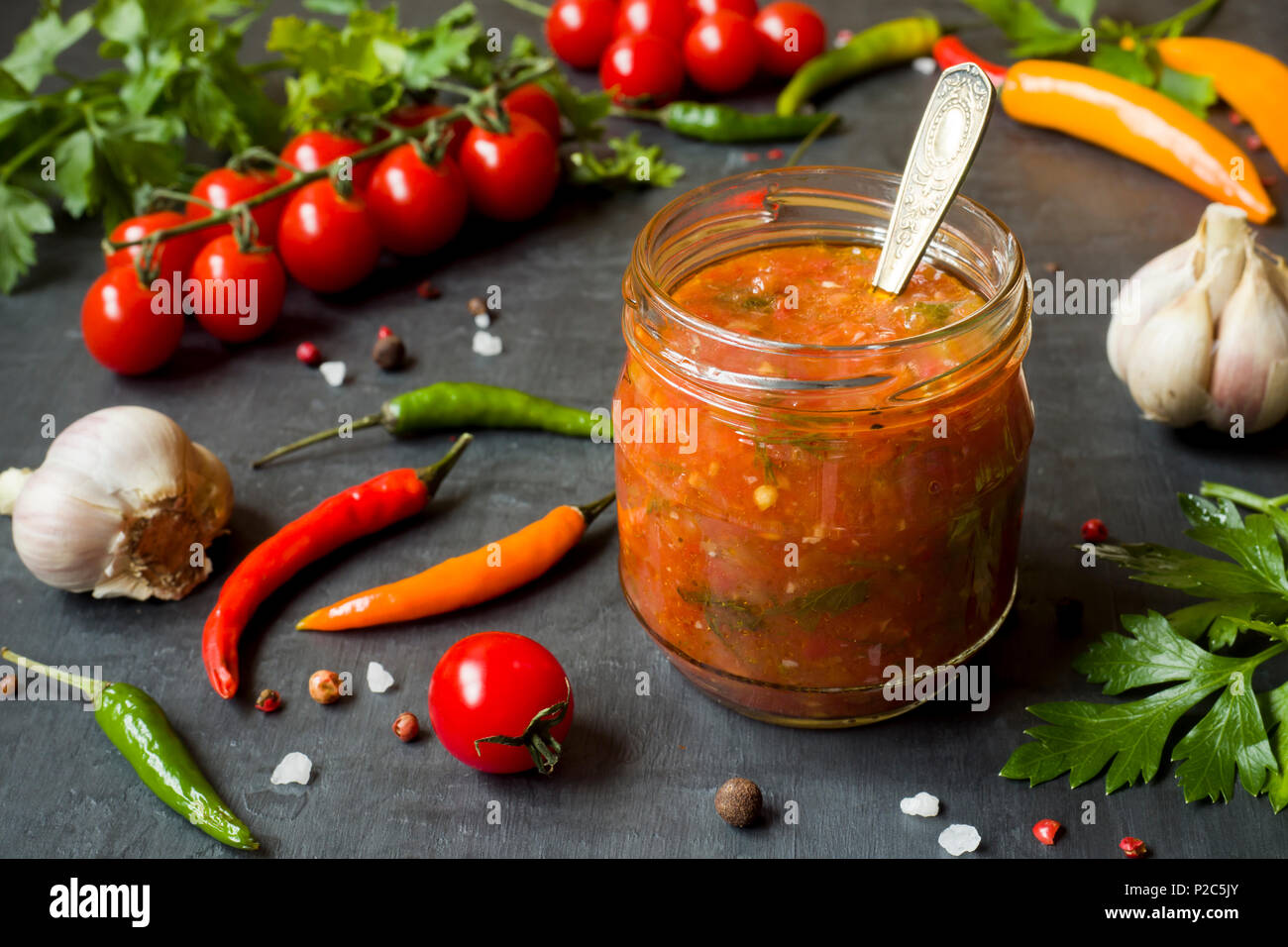 Sauce ketchup, Lecho in glass jar. Chili tomato cherry garlic and other ...