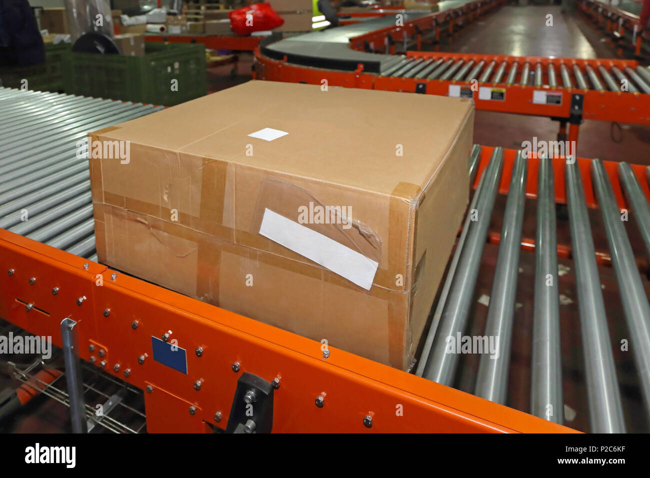 Shipping Box at Conveyor Belt in Distribution Warehouse Stock Photo - Alamy