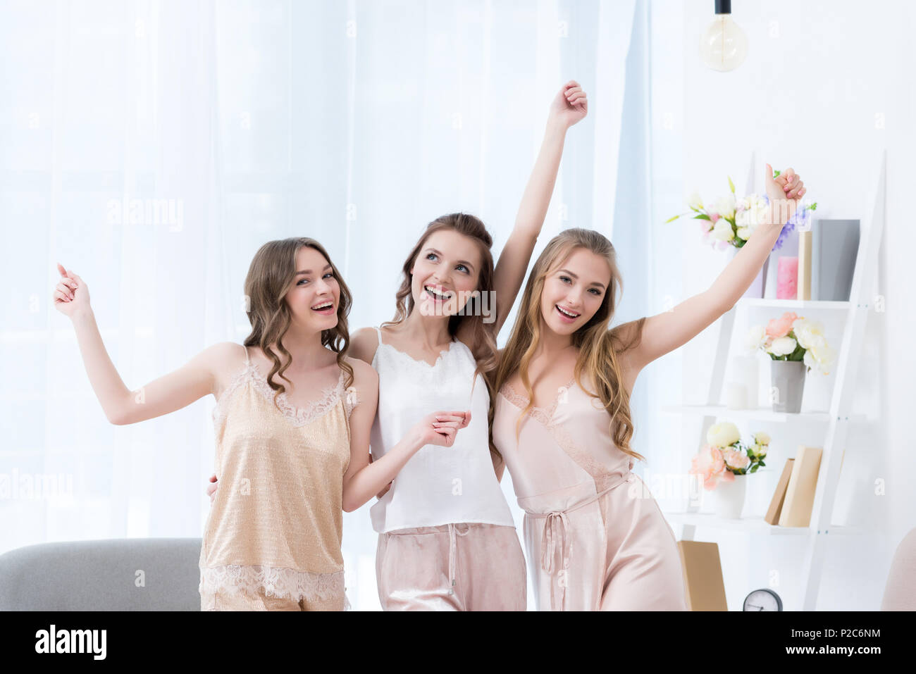 beautiful happy young women having fun together at pajama party Stock ...