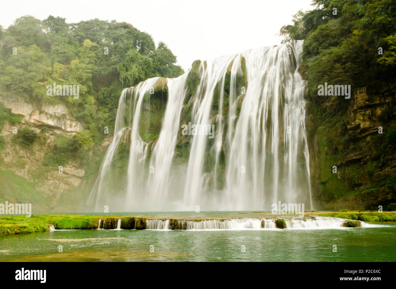The Huangguoshu waterfall, almost 75 meters high and 100 meters wide ...