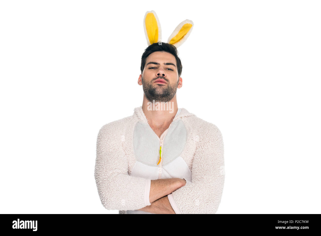 Man wearing rabbit costume and standing with crossed arms isolated on ...
