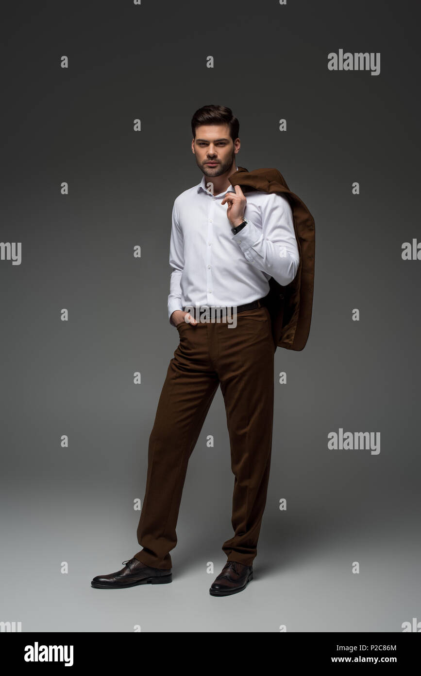 Holding jacket on shoulder hi-res stock photography and images - Alamy