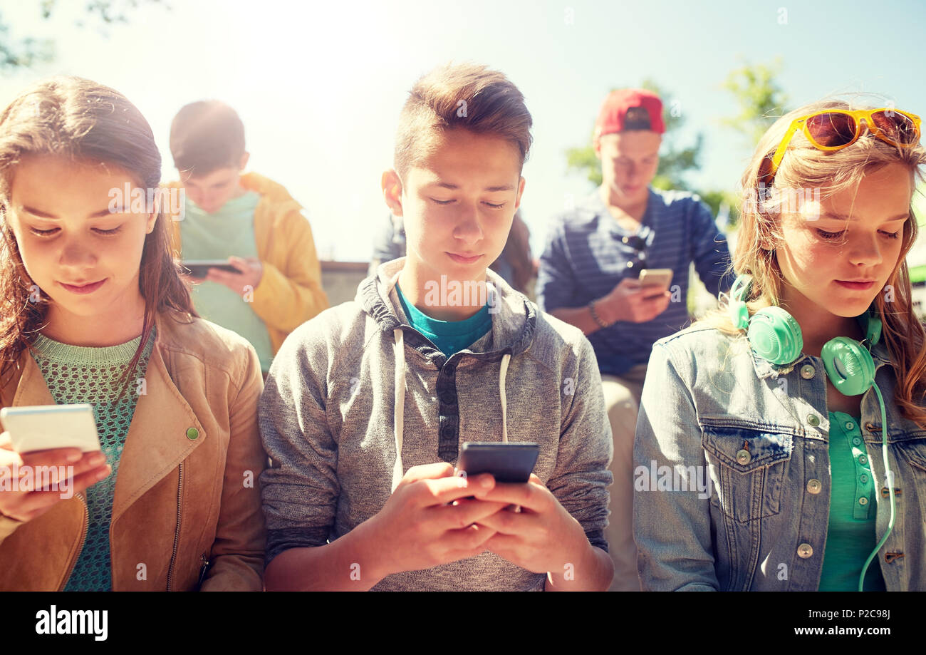 group of teenage friends with smartphones outdoors Stock Photo - Alamy