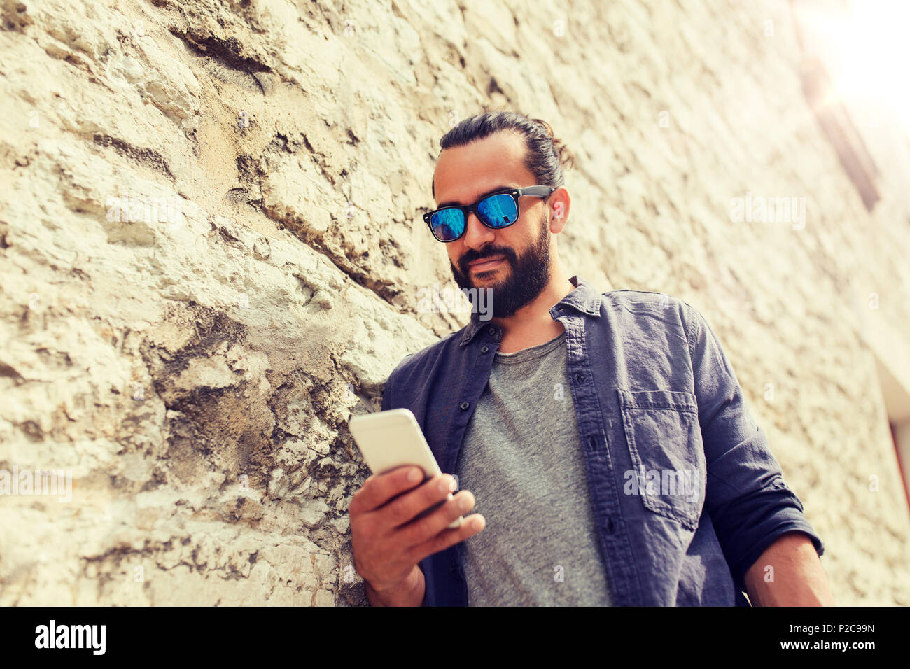 Young happy man texting message hi-res stock photography and images - Alamy