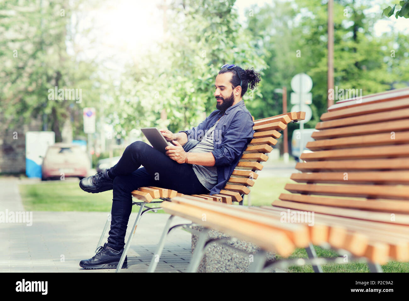 Person on street bench city hi-res stock photography and images - Alamy