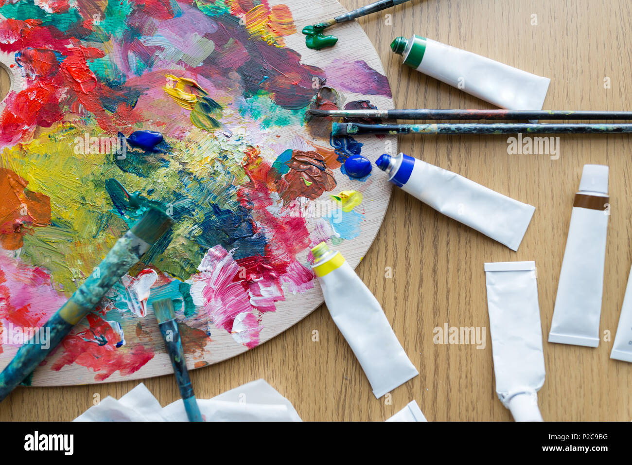 palette, brushes and paint tubes on table Stock Photo - Alamy