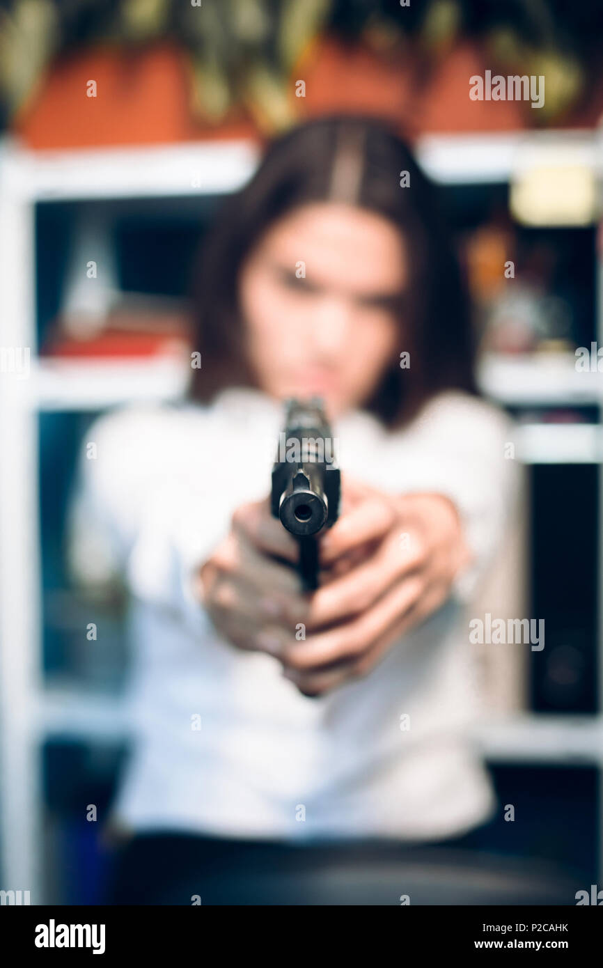 Pretty girl with gun hi-res stock photography and images - Alamy