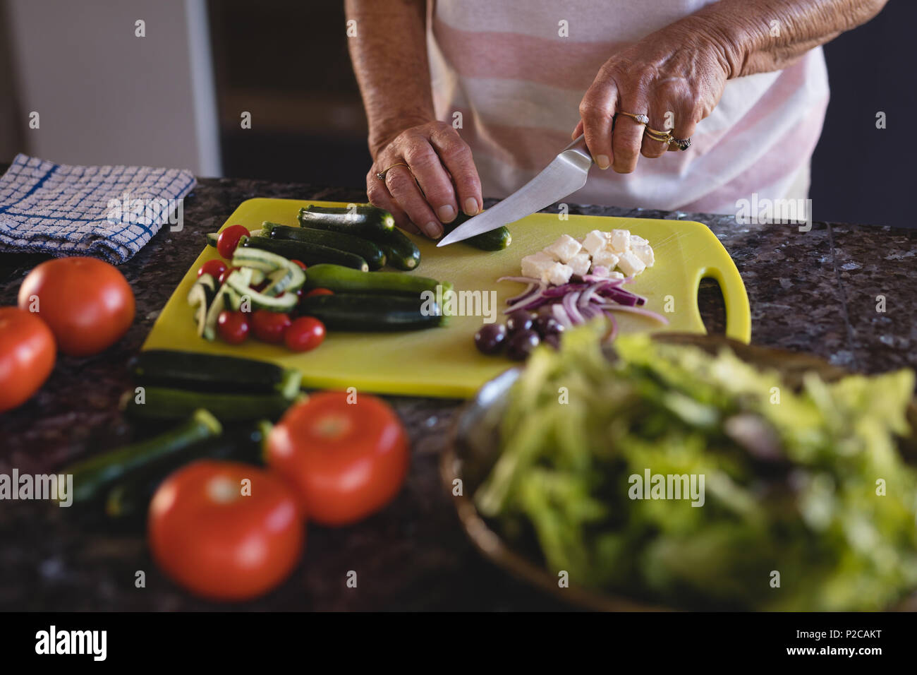 Woman cutting vegetables in kitchen hi-res stock photography and images ...