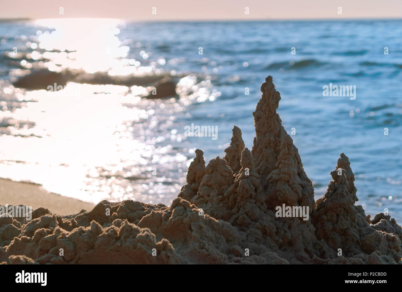 sand castle at sunset by the sea, sand castle on the sea shore Stock ...