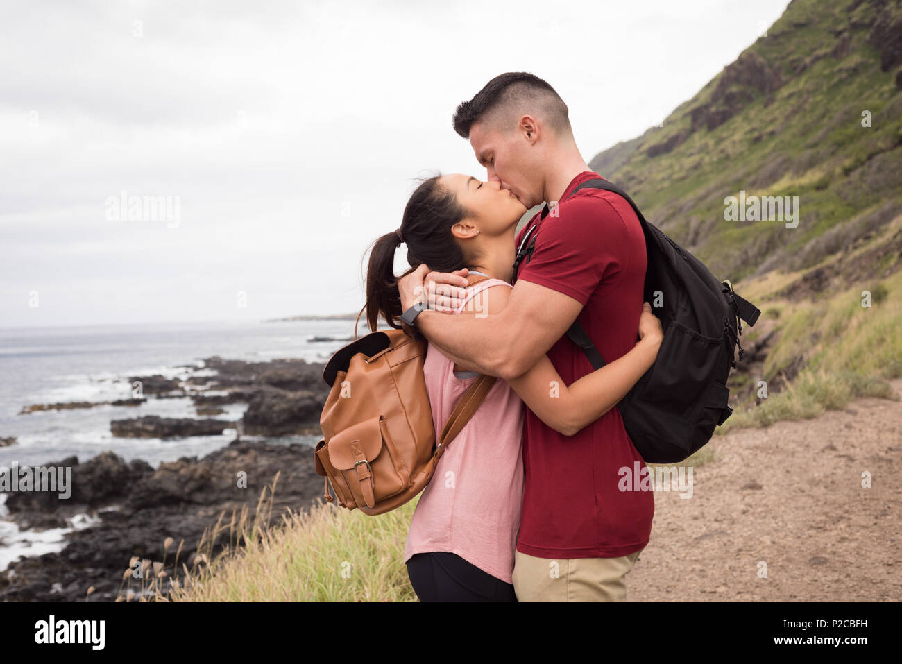 Beautiful couple standing together kissing hi-res stock photography and ...