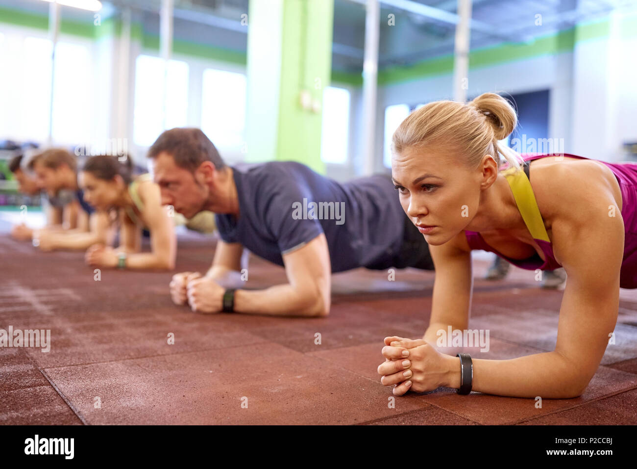 woman with heart-rate tracker exercising in gym Stock Photo - Alamy
