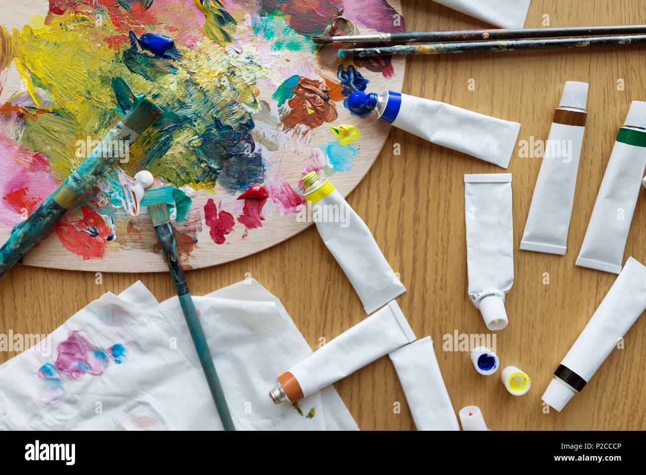 palette, brushes and paint tubes on table Stock Photo - Alamy