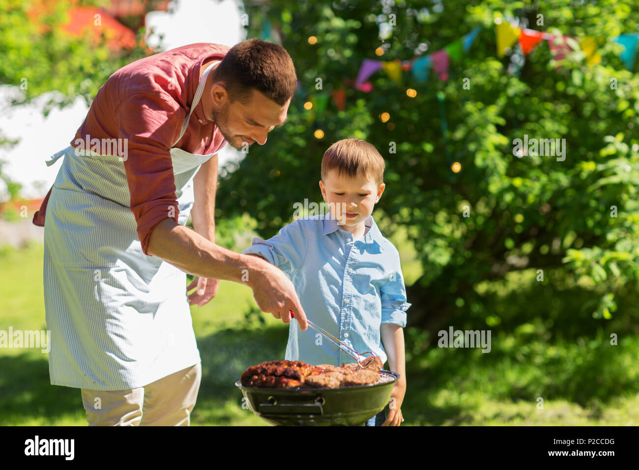 Boy father cooking hi-res stock photography and images - Alamy
