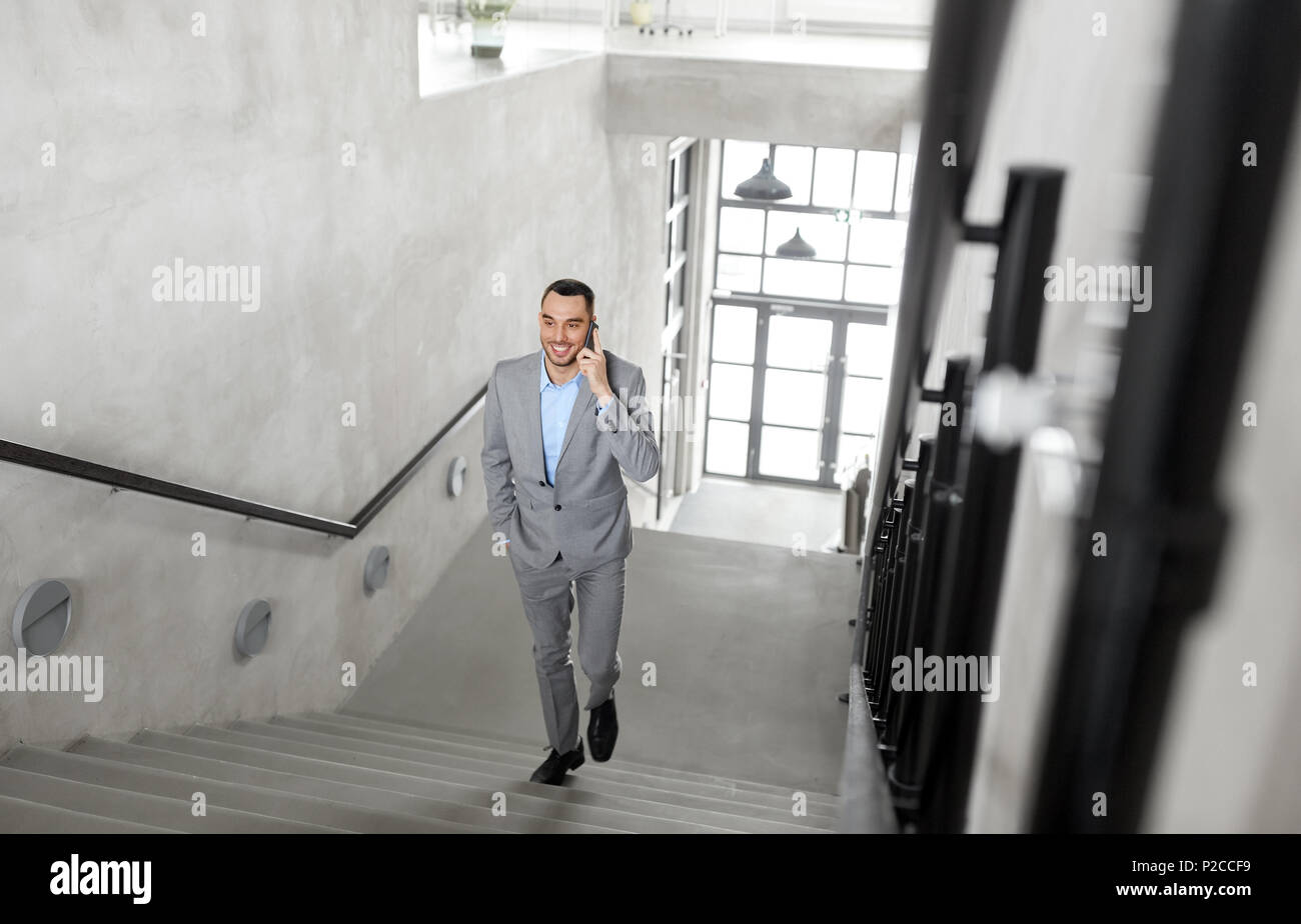 businessman calling on smartphone at office Stock Photo - Alamy