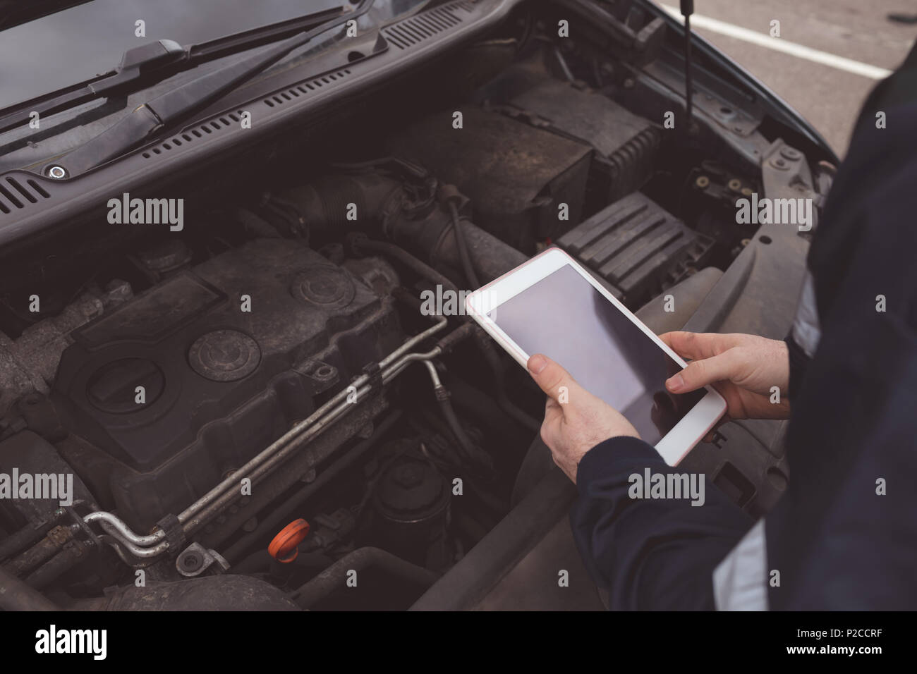 Mechanic garage tablet hi-res stock photography and images - Alamy