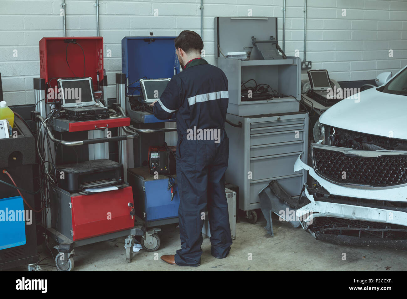 Mechanic repairing open engine vehicle hi-res stock photography and ...