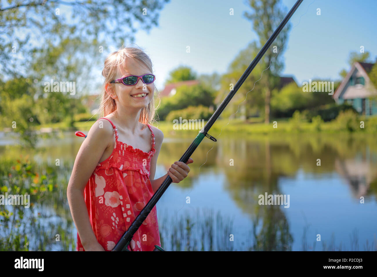 Girl With Rod And Small Fish High Resolution Stock Photography and ...