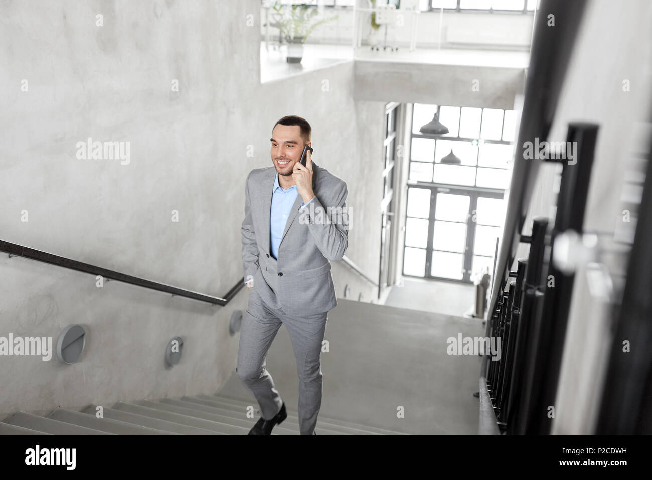 businessman calling on smartphone at office Stock Photo - Alamy