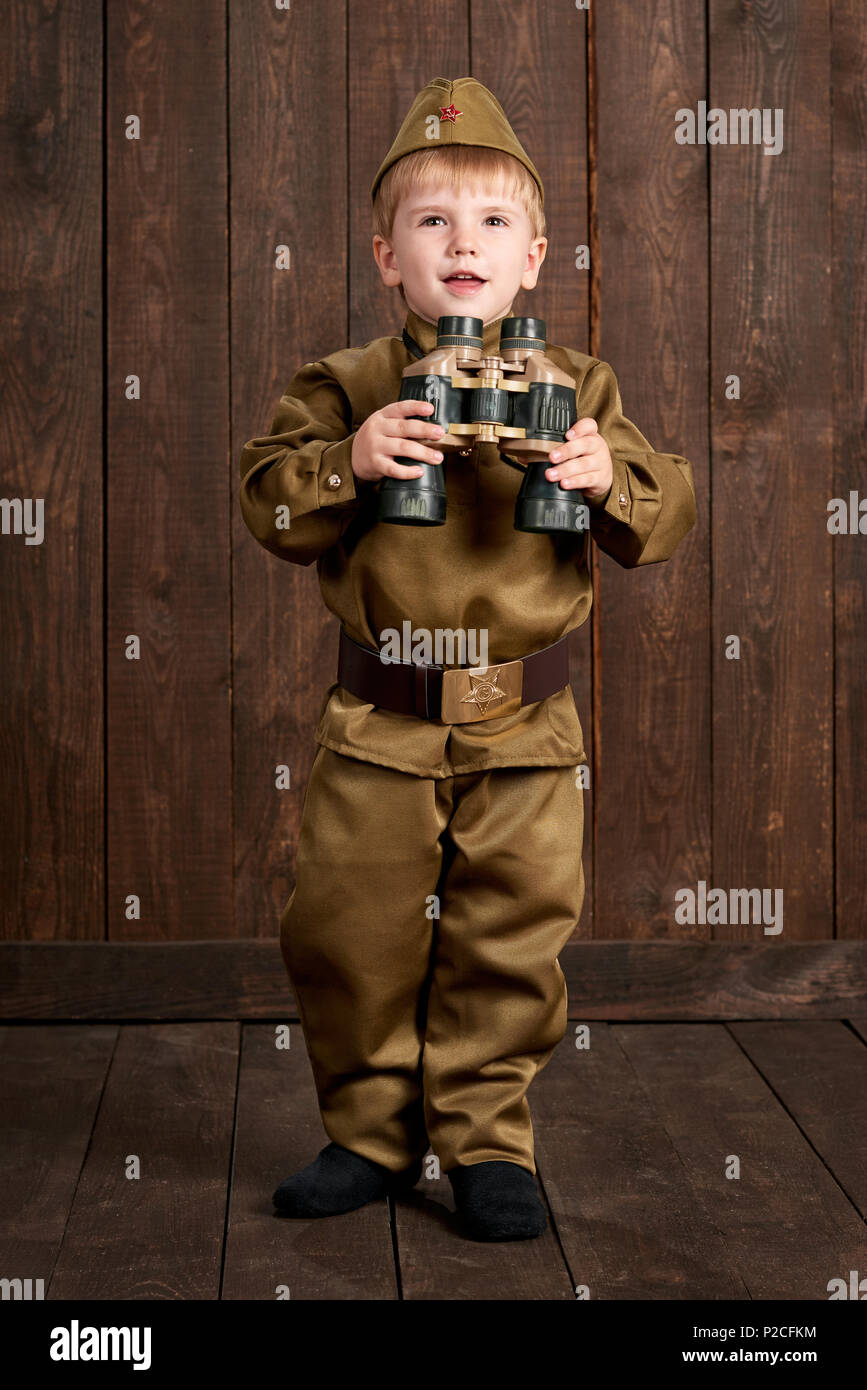 children are dressed as soldier in retro military uniforms Stock Photo ...