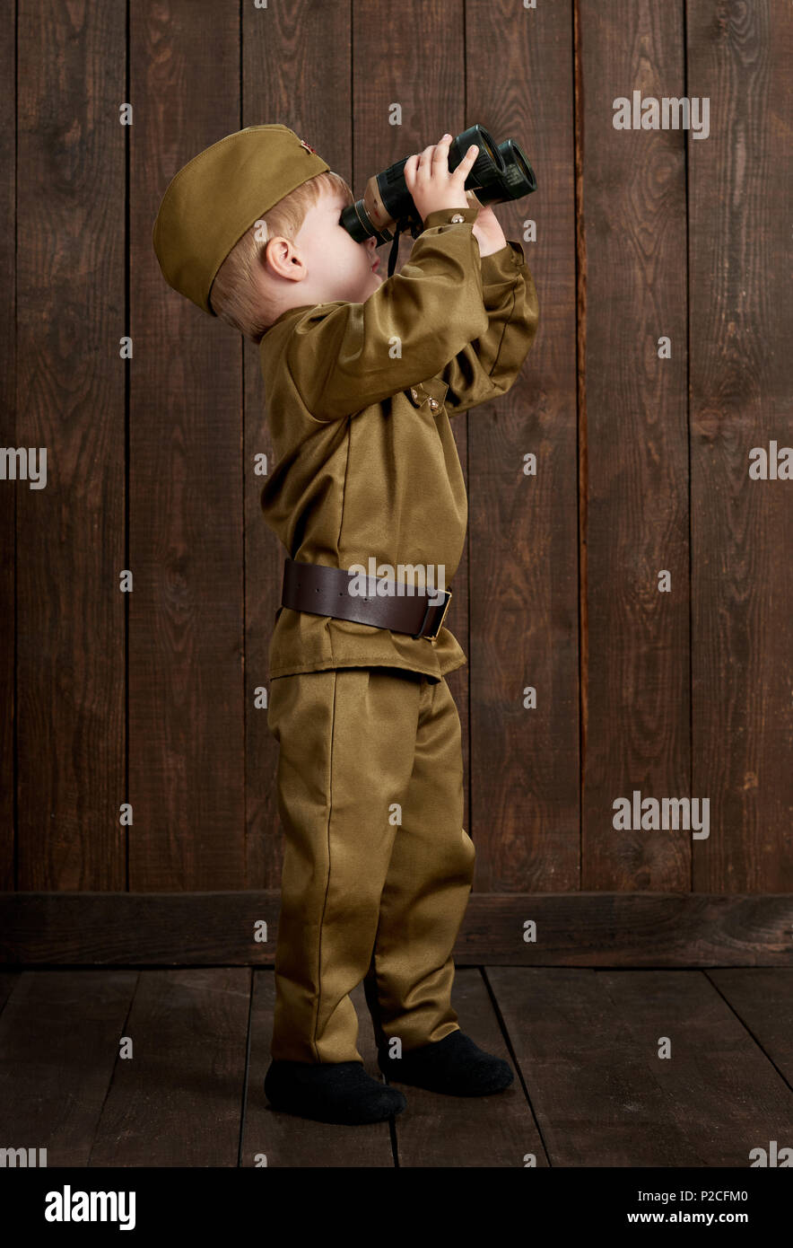 children are dressed as soldier in retro military uniforms Stock Photo ...