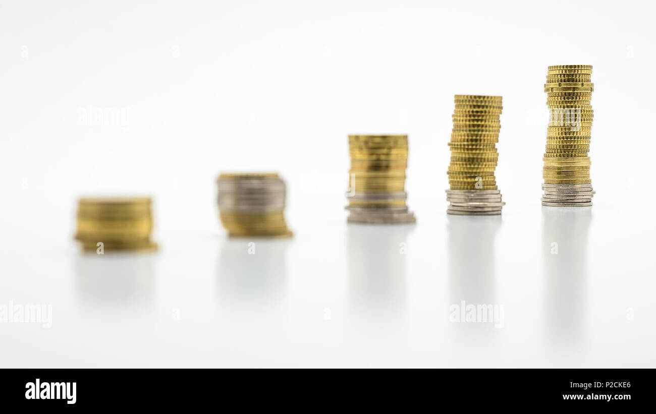 Stack of coins, five of rows isolated on white background. Growing and ...