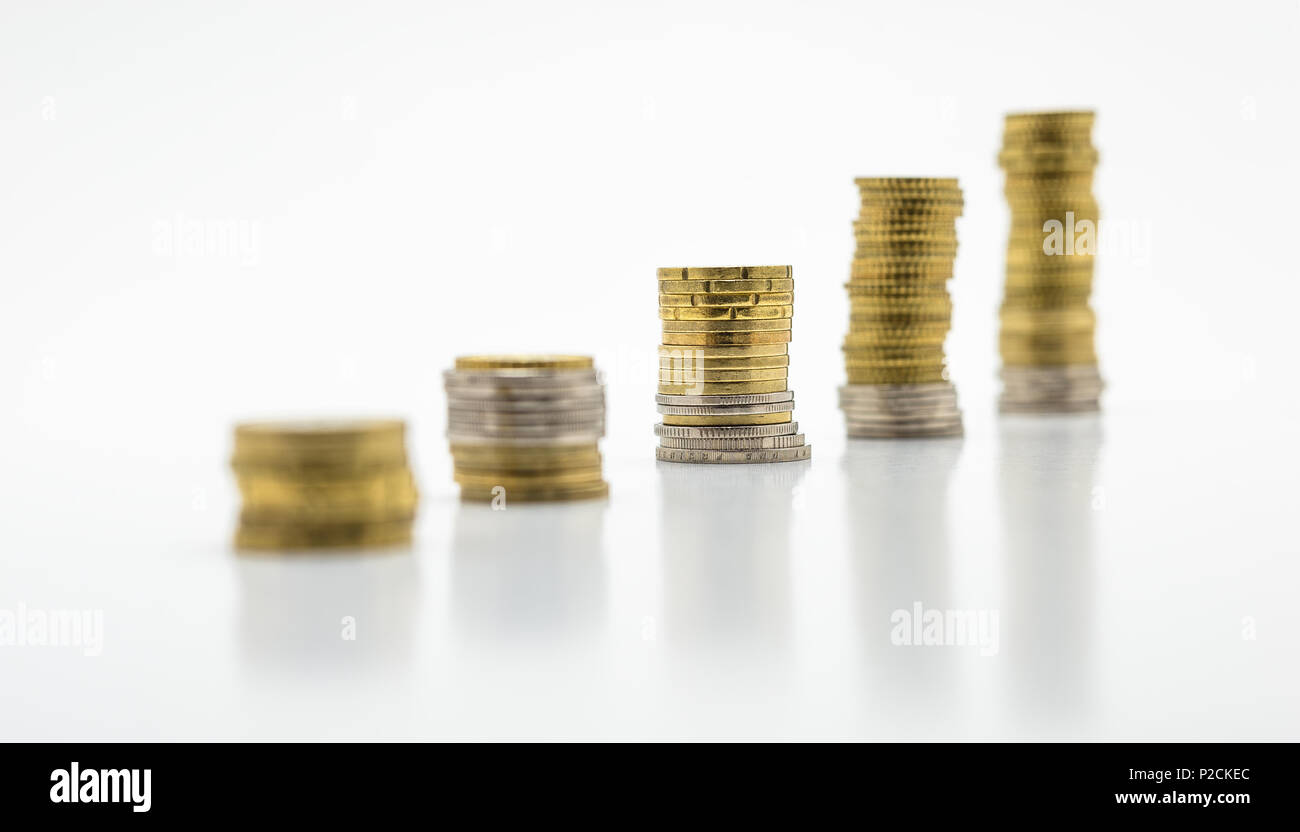 Stack of coins, five of rows isolated on white background. Growing and ...