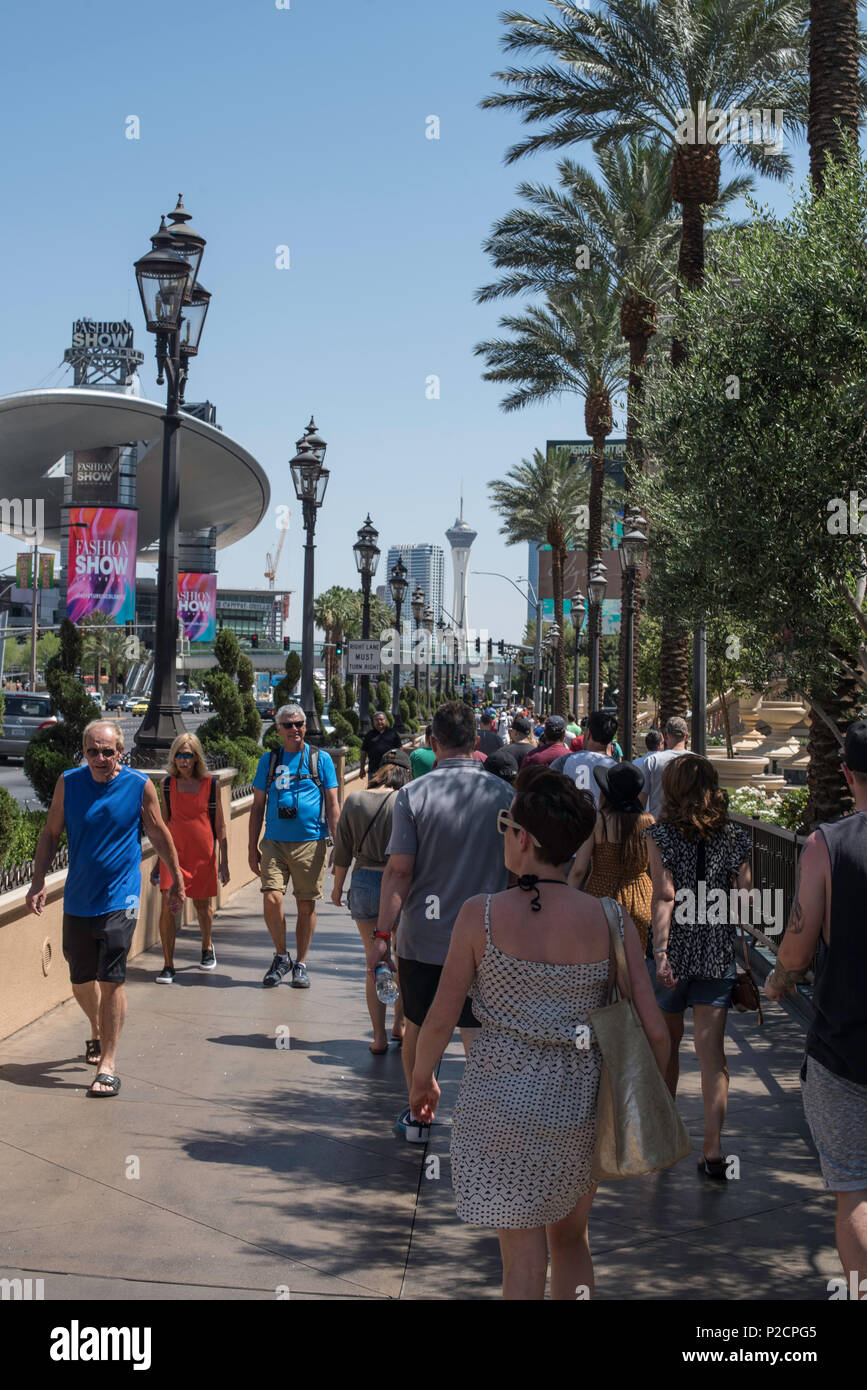 Tourist and people walking along Las Vegas Boulevard enjoying the hot ...
