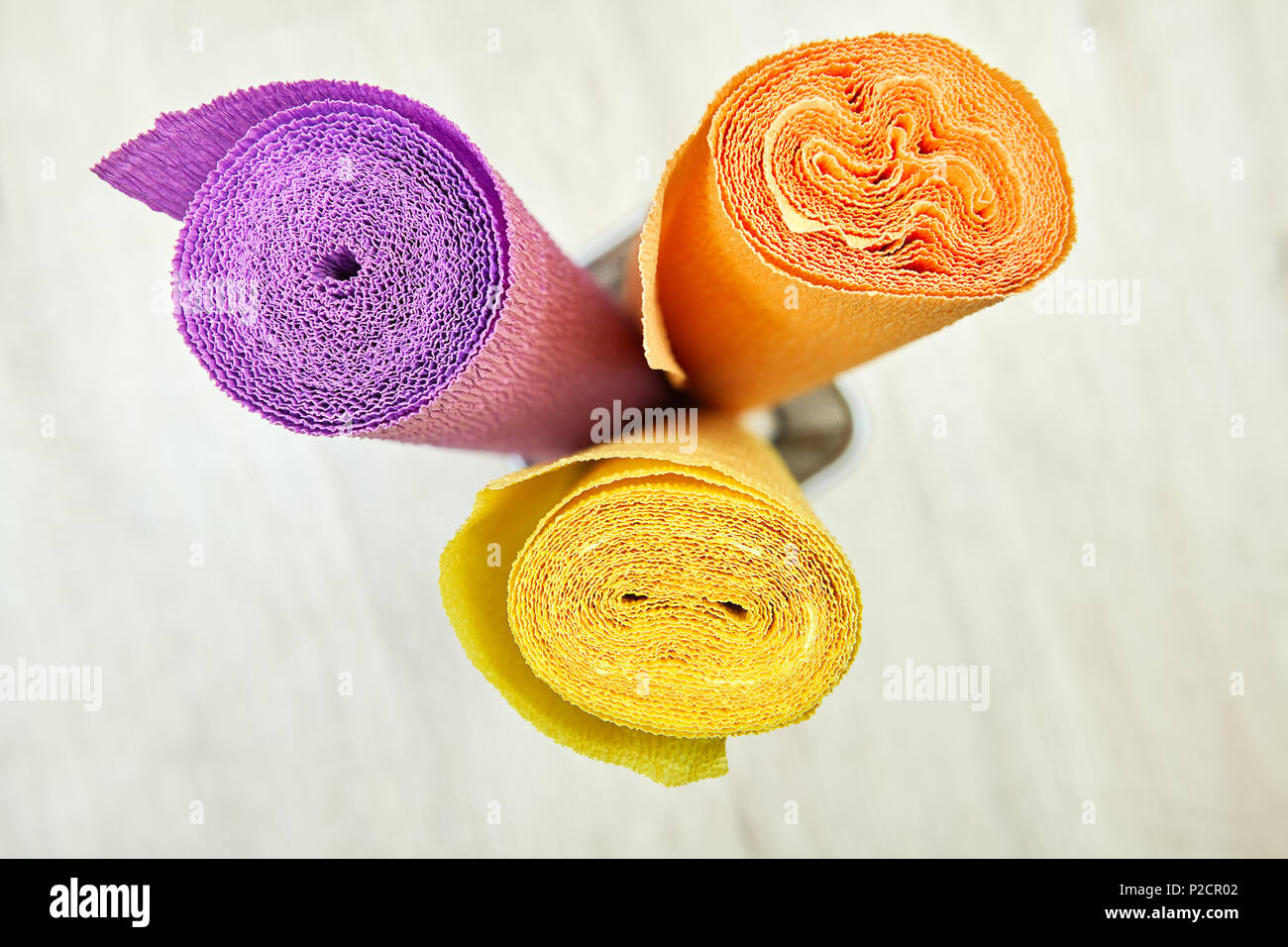 Top view of three rolls of multi-colored crinkle paper for creativity ...
