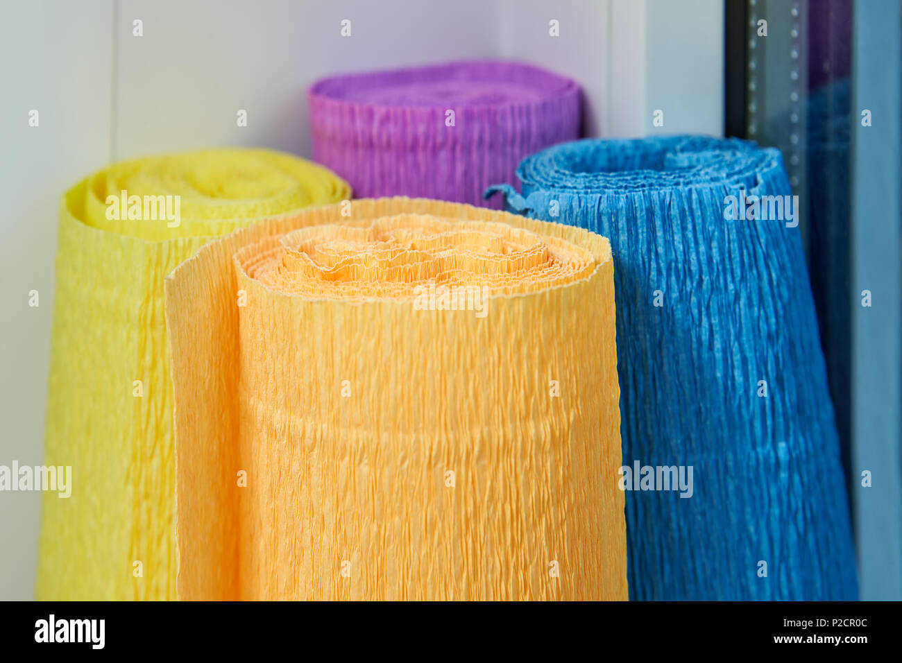 Four multi-colored rolls of wrinkled paper for needlework Stock Photo ...