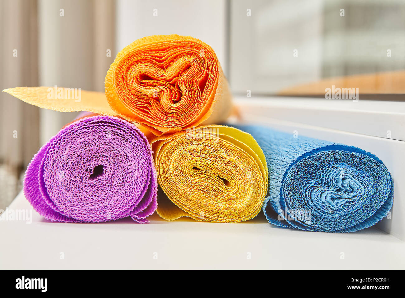 Few multi colored rolls of crepe paper for crafts Stock Photo - Alamy