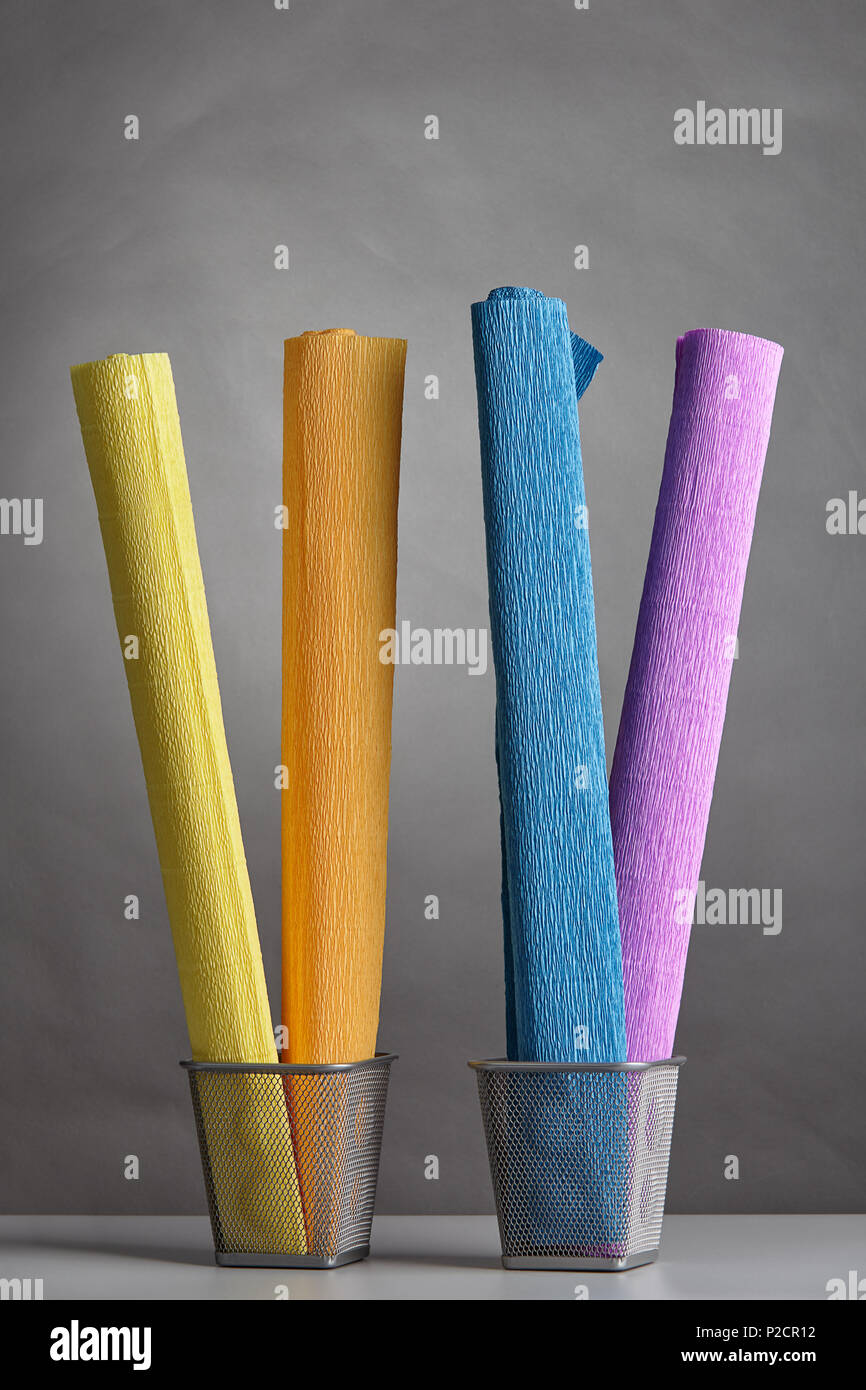 Four rolls of wrinkly corrugated paper of multy colors, twisted into ...