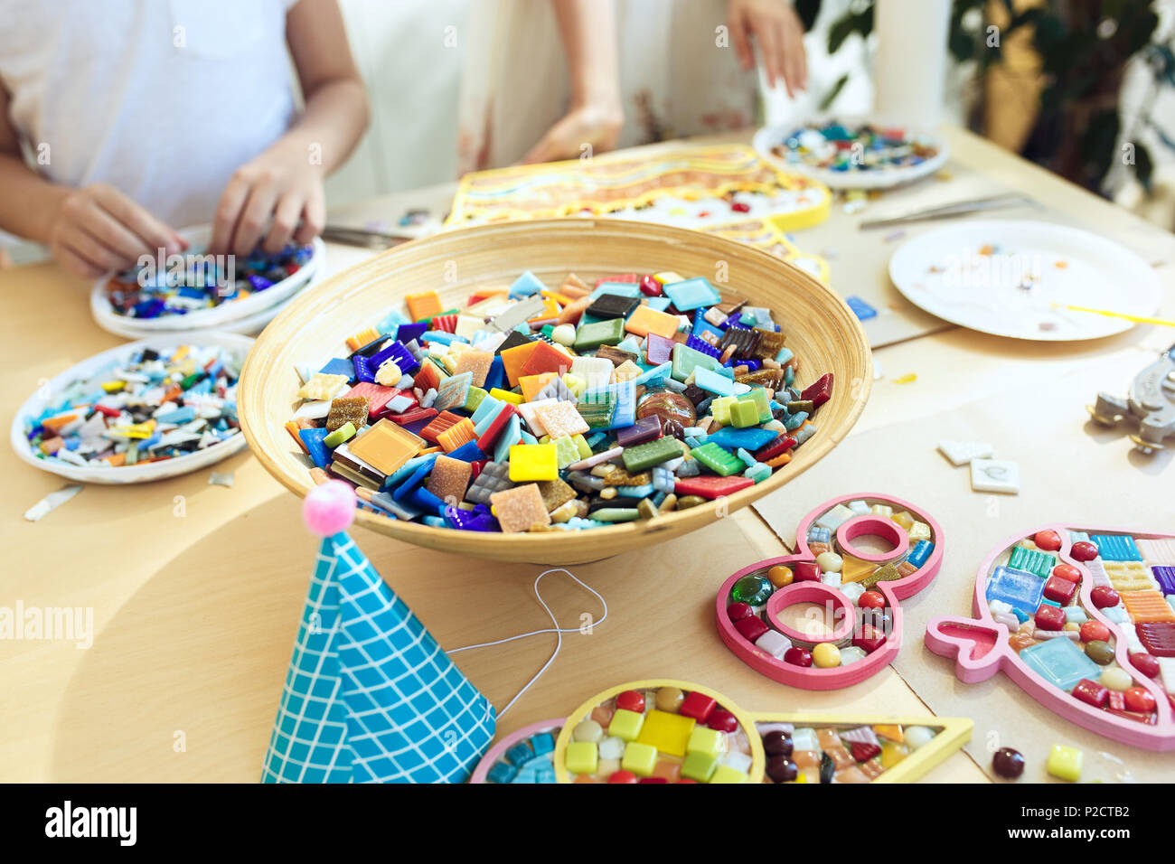 mosaic puzzle art for kids, children's creative game. two sisters are ...