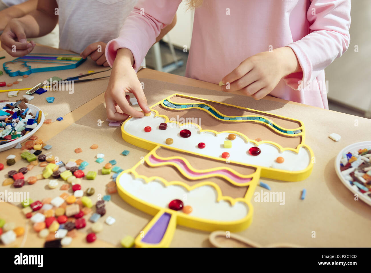 mosaic puzzle art for kids, children's creative game. two sisters are ...