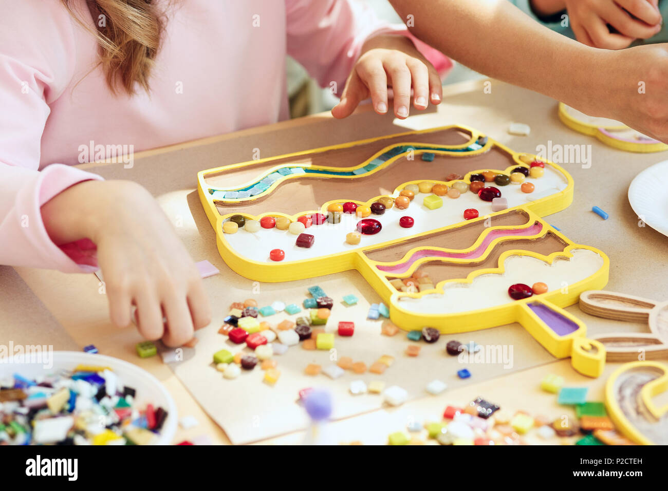 mosaic puzzle art for kids, children's creative game. two sisters are ...