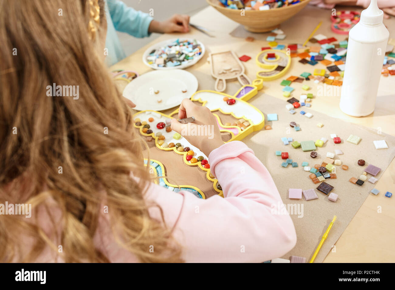 mosaic puzzle art for kids, children's creative game. two sisters are ...