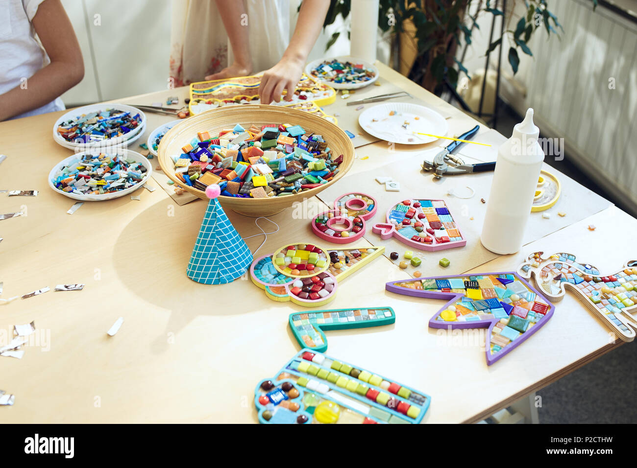 mosaic puzzle art for kids, children's creative game. two sisters are ...