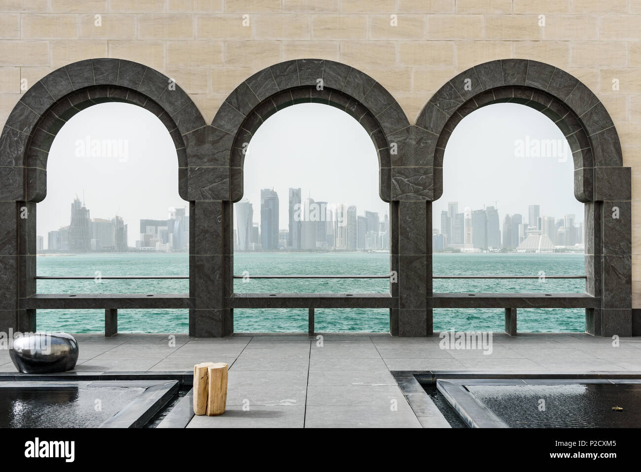 Doha skyline and arches at Museum of Islamic art, Qatar Stock Photo - Alamy