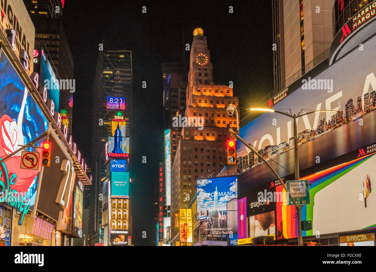View of the animated and illuminated advertising screens at night in ...