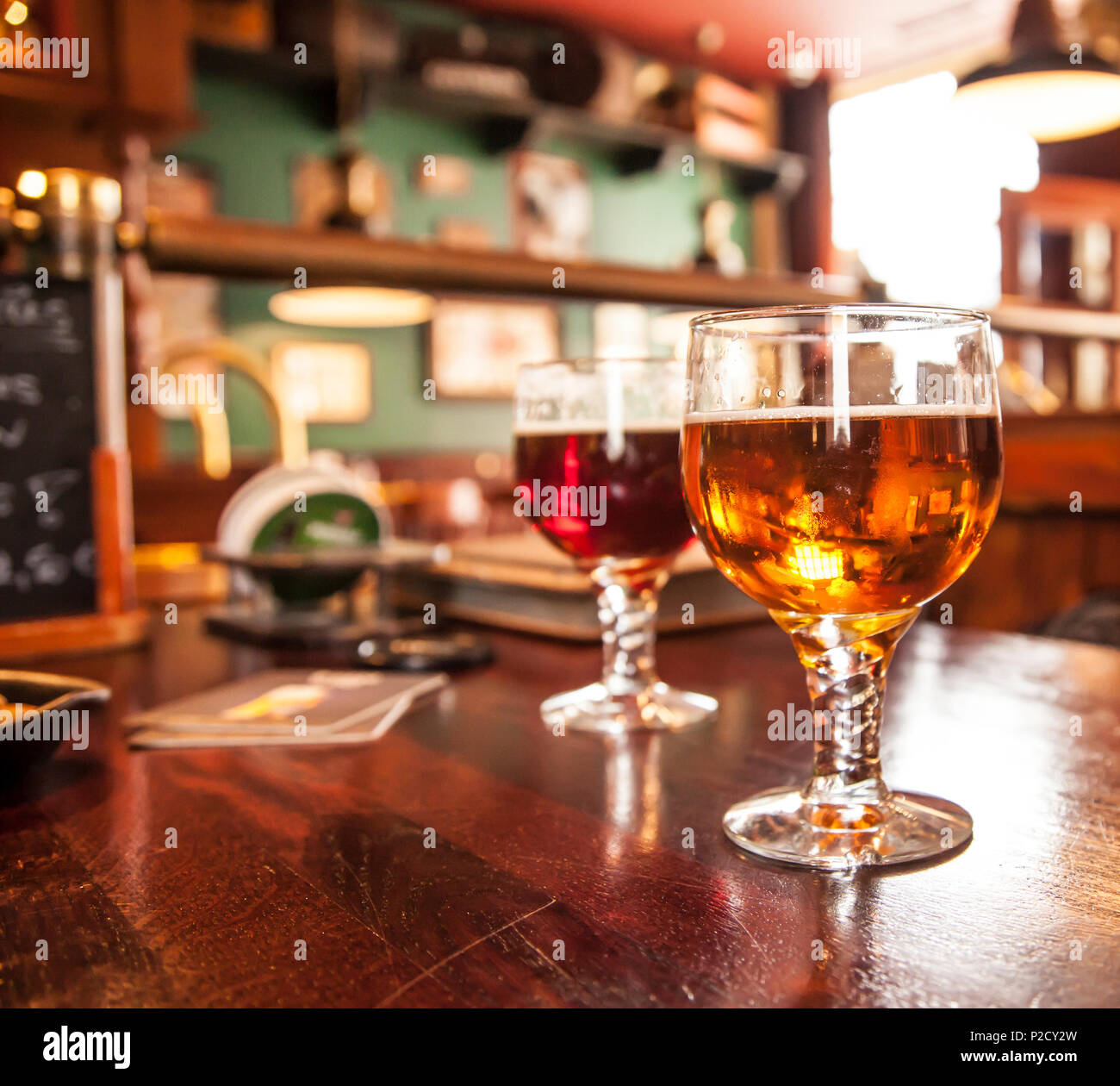 Two glasses of draught beer, a red and a amber beer Stock Photo - Alamy
