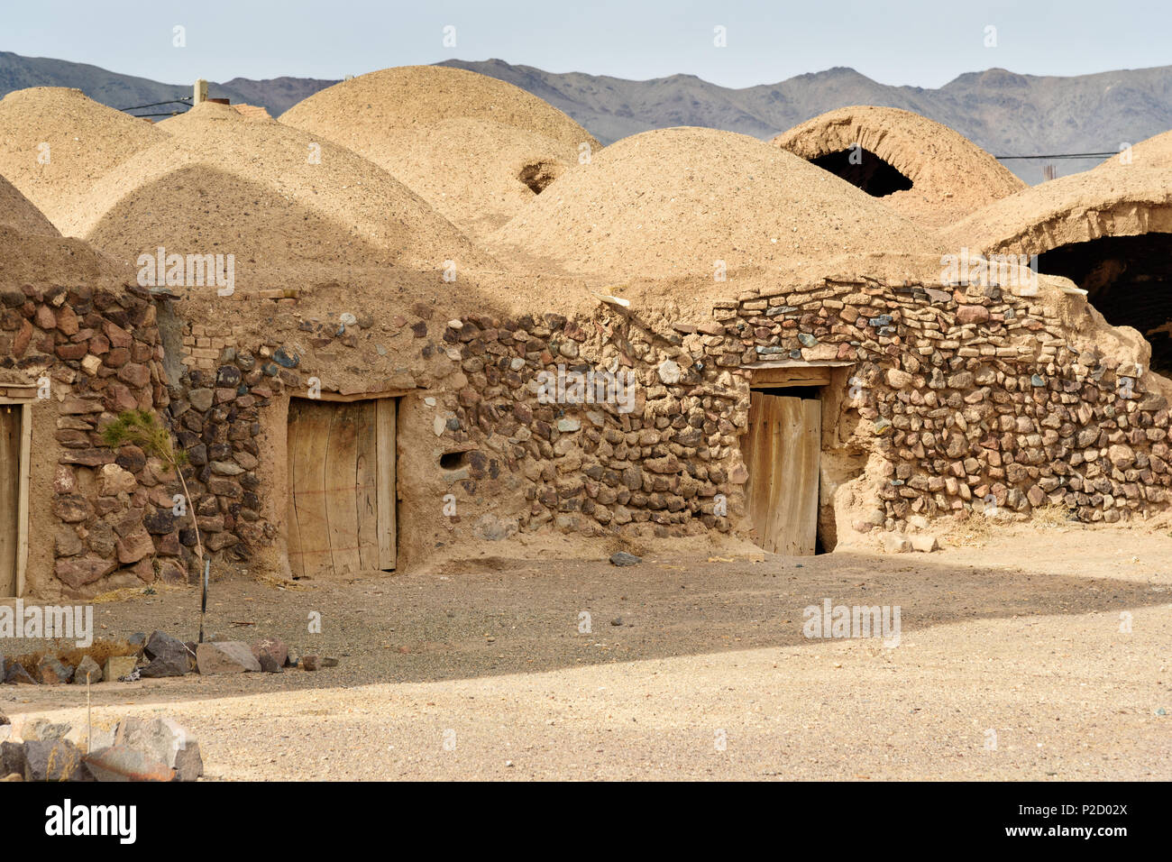Old houses with dome roof. Traditional Iranian adobe village in Isfahan ...