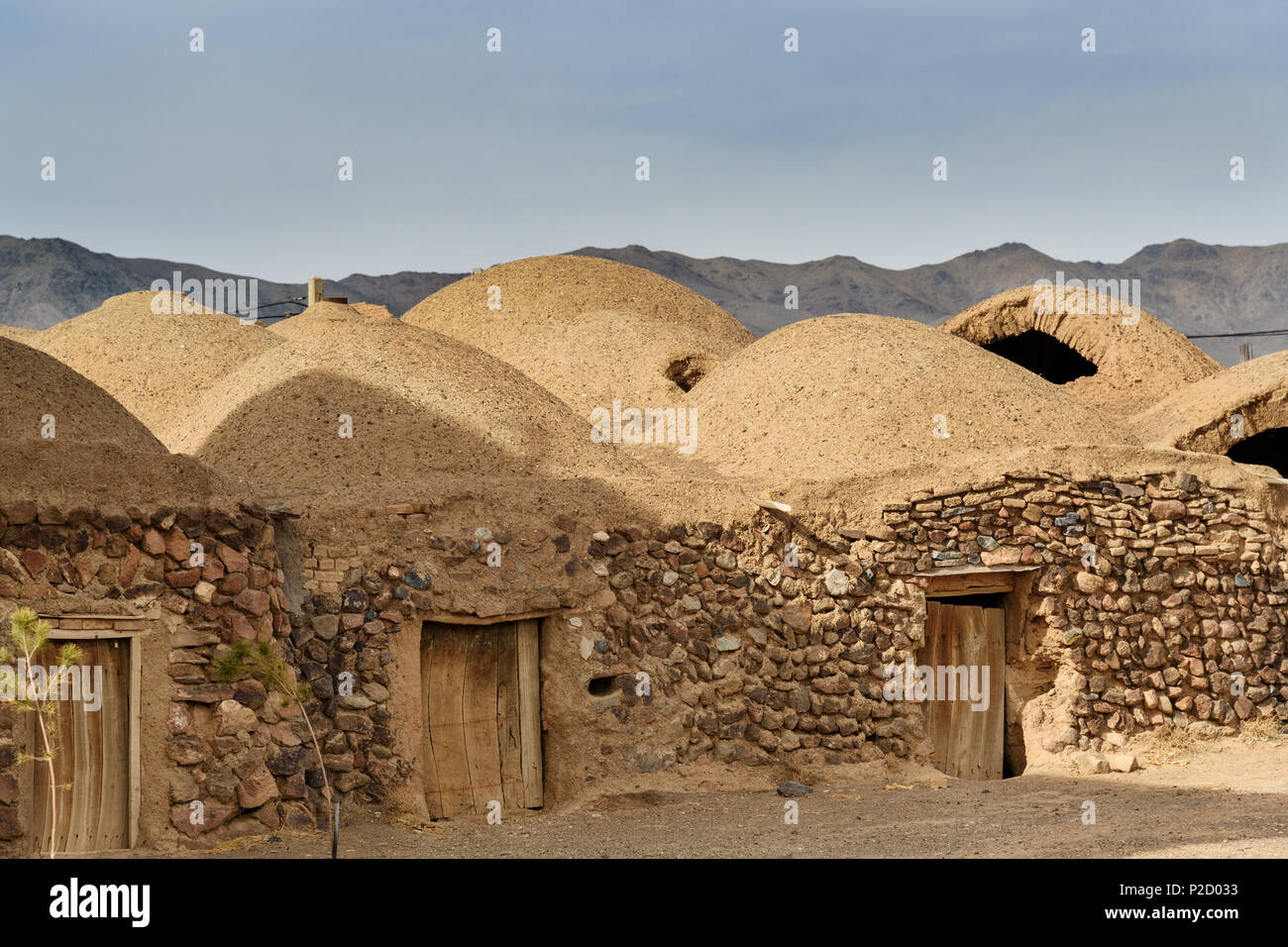 Old houses with dome roof. Traditional Iranian adobe village in Isfahan ...