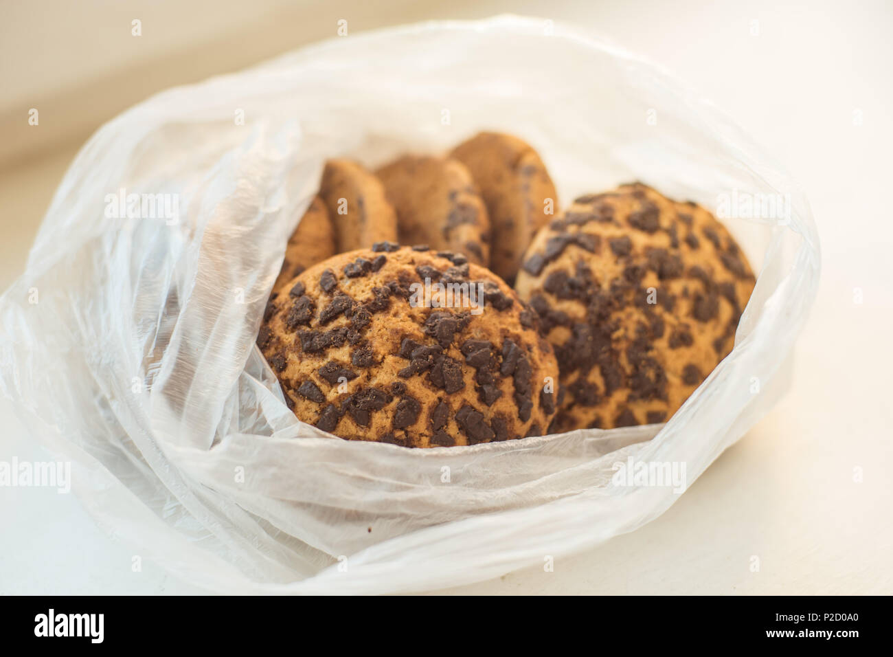 oatmeal cookies sprinkled with chocolate slices in a transparent bag ...