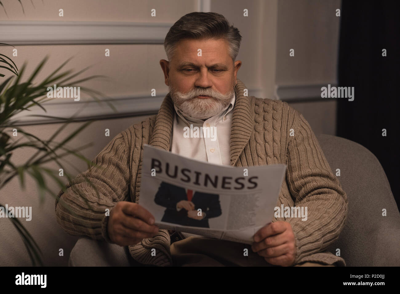 Senior male newspaper armchair hi-res stock photography and images - Alamy