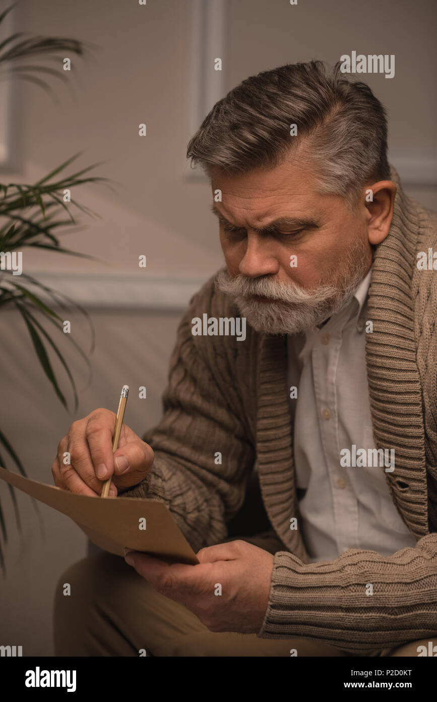Old man writing letter hi-res stock photography and images - Alamy
