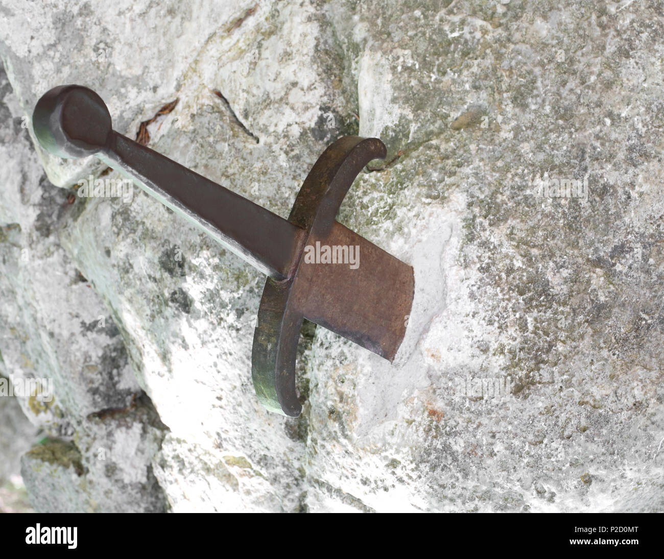 Ancient magic sword Excalibur in the stone Stock Photo - Alamy