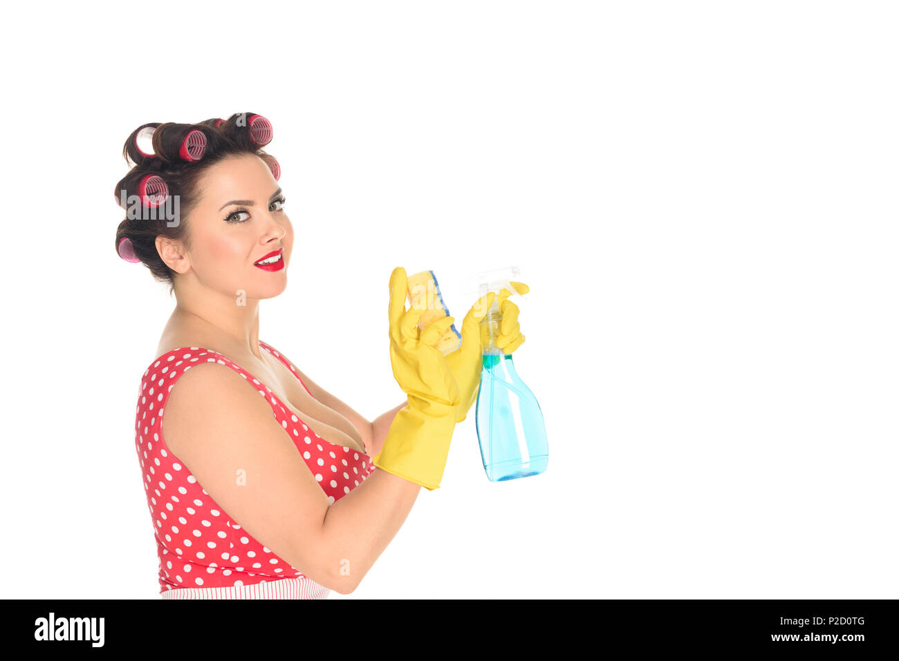 side view of plus size woman in rubber gloves with cleaning supplies ...