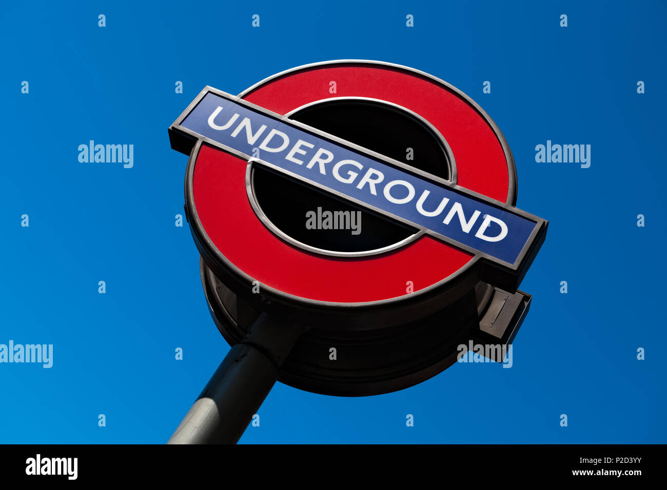 Underground sign against the blue sky, London Stock Photo - Alamy