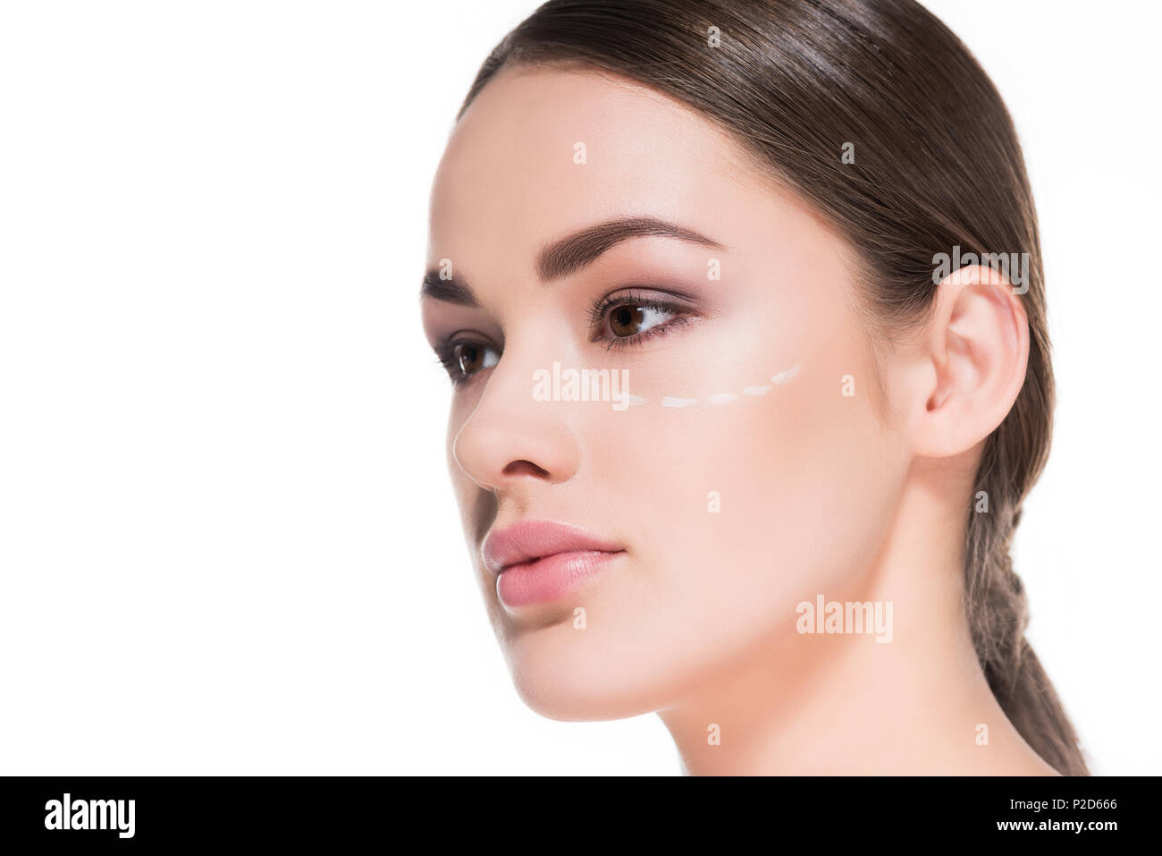 close-up shot of beautiful young woman with dotted line on face ...